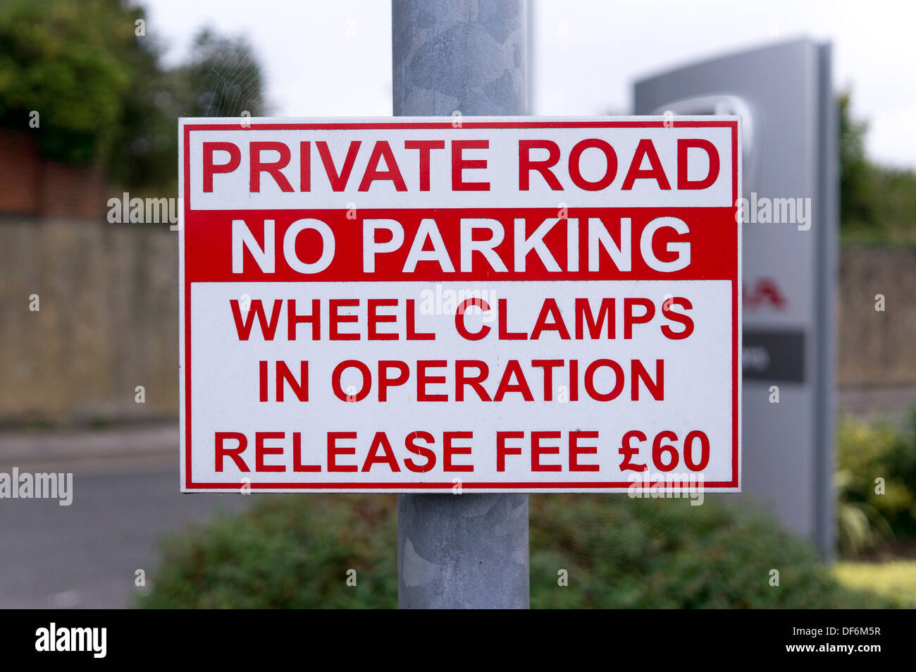 Parking restriction sign with warning of wheel clamping and release fee ...