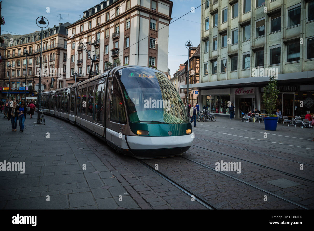 A photograph of a tram in Strasbourg, France. It is a modern looking ...