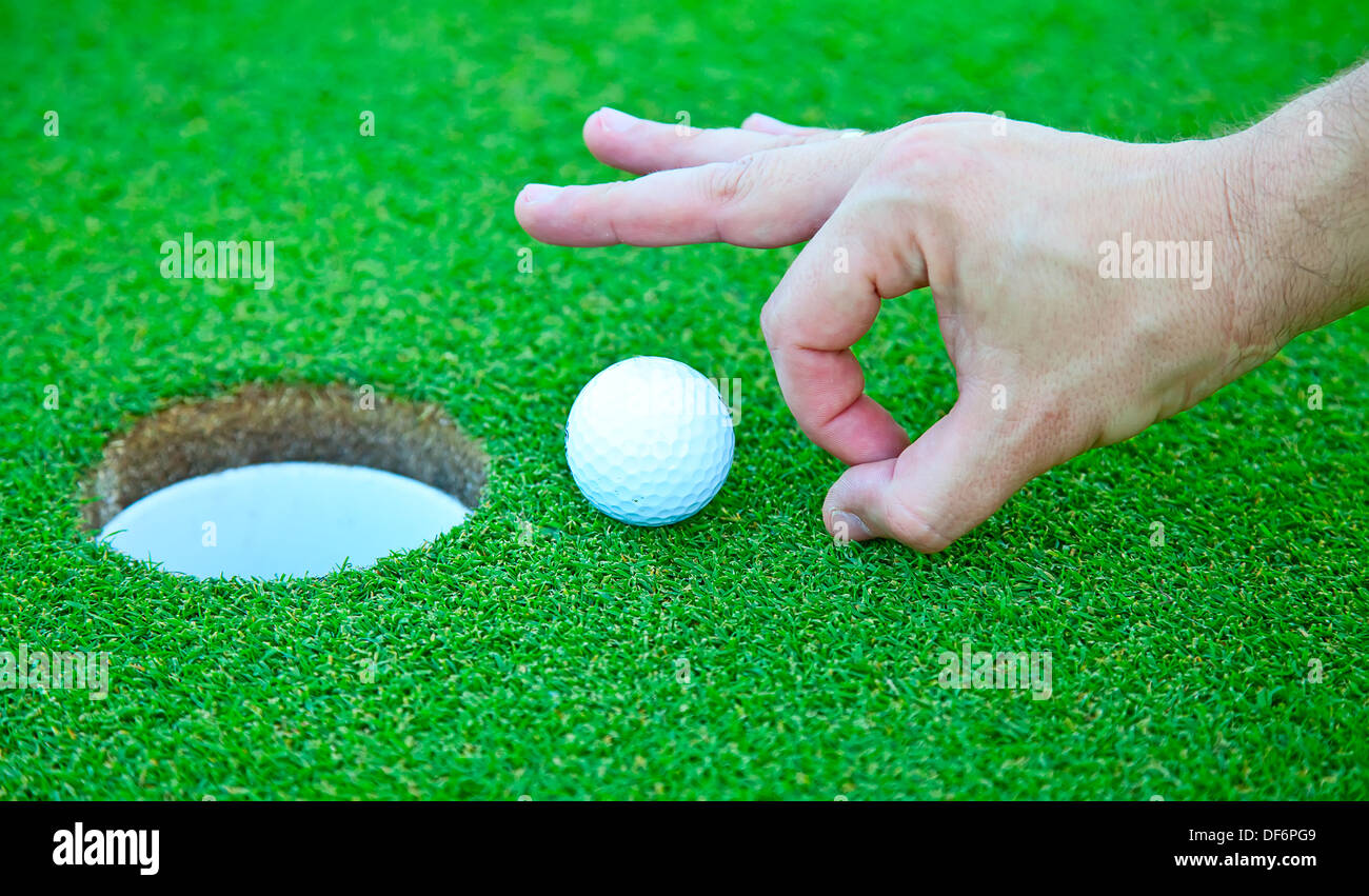 golf ball near the hole Stock Photo - Alamy