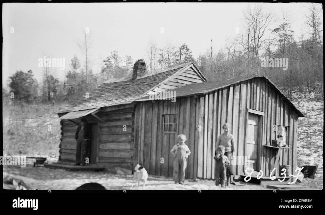 The Palmer family is pictured in front of their home, reflecting ...