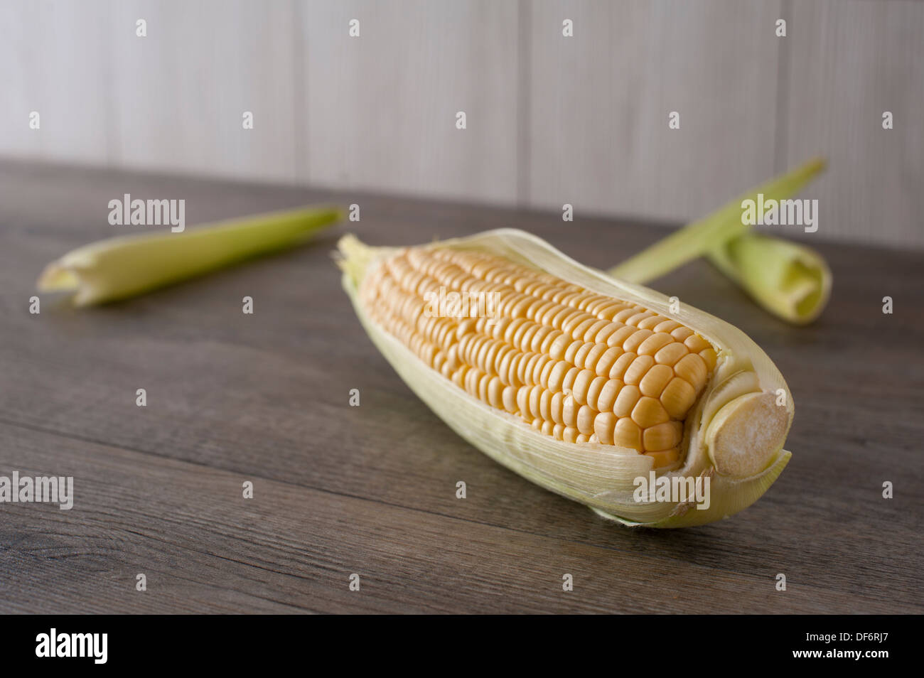 Corn with husk hi-res stock photography and images - Alamy
