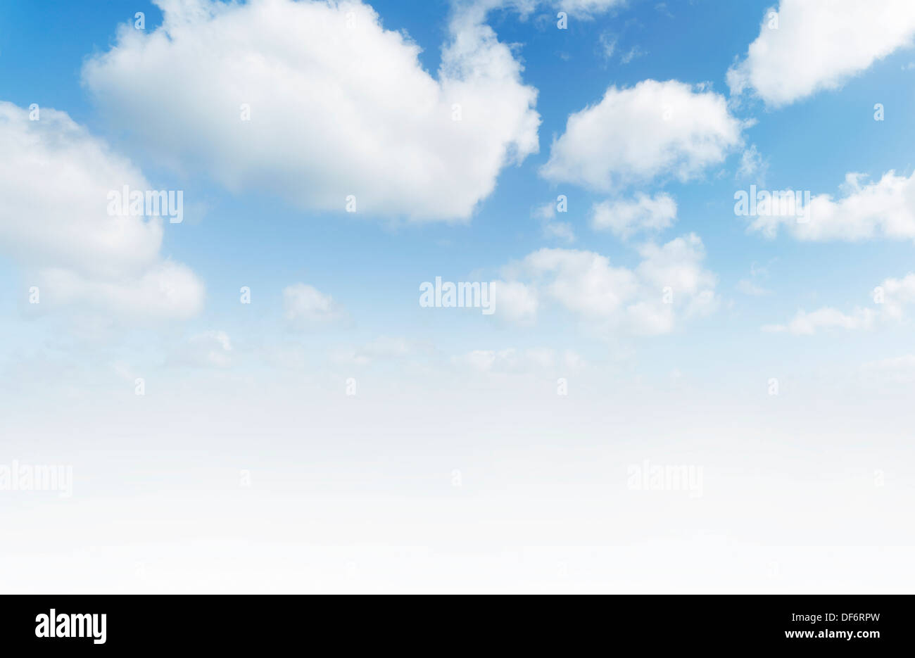 White clouds in blue sky. Large hi-res file. Advertising copy space below Stock Photo - Alamy