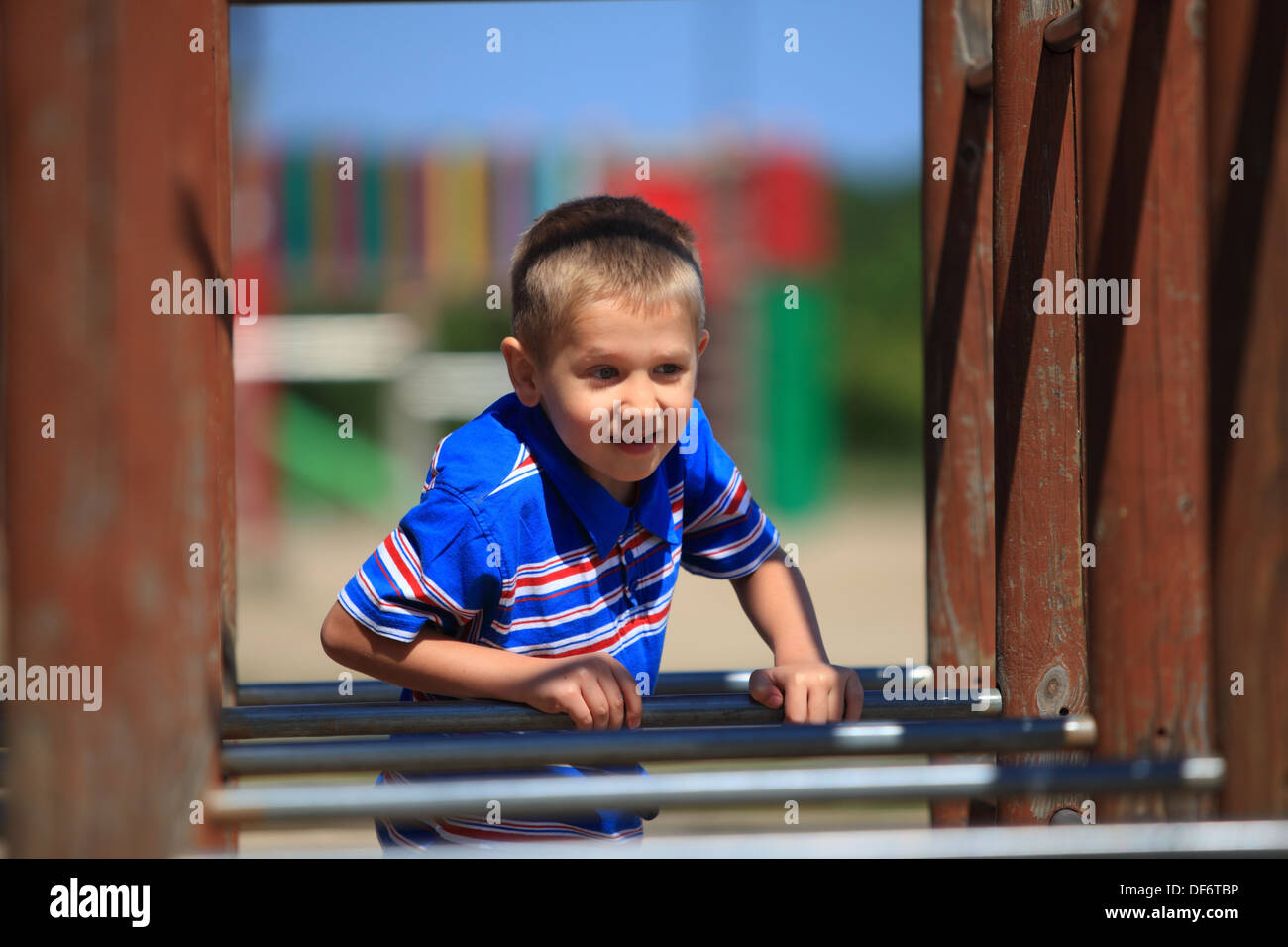child in playground kid in action boy play on leisure equipment ...