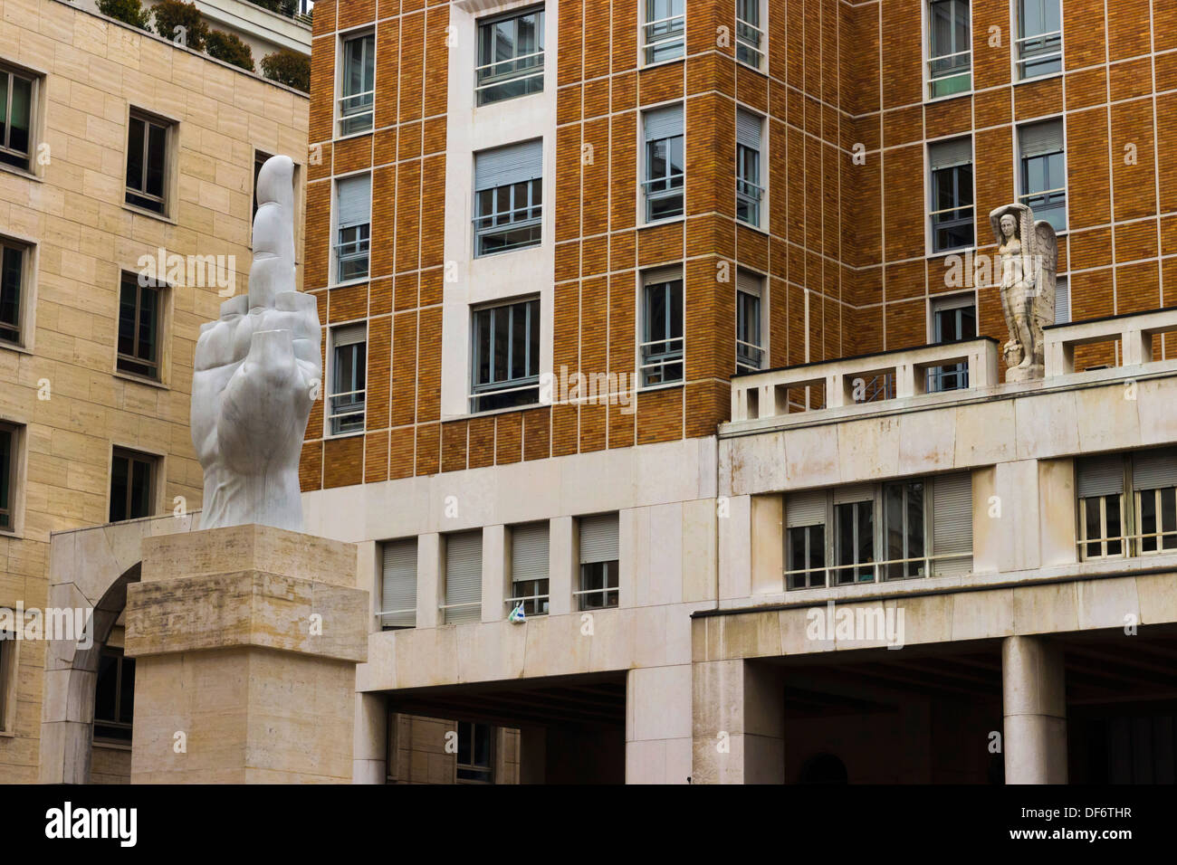 A provocative statue by Cattelan in Milan, Italy Stock Photo - Alamy