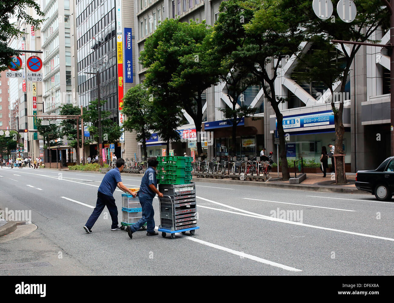 men with trolleys Stock Photo - Alamy