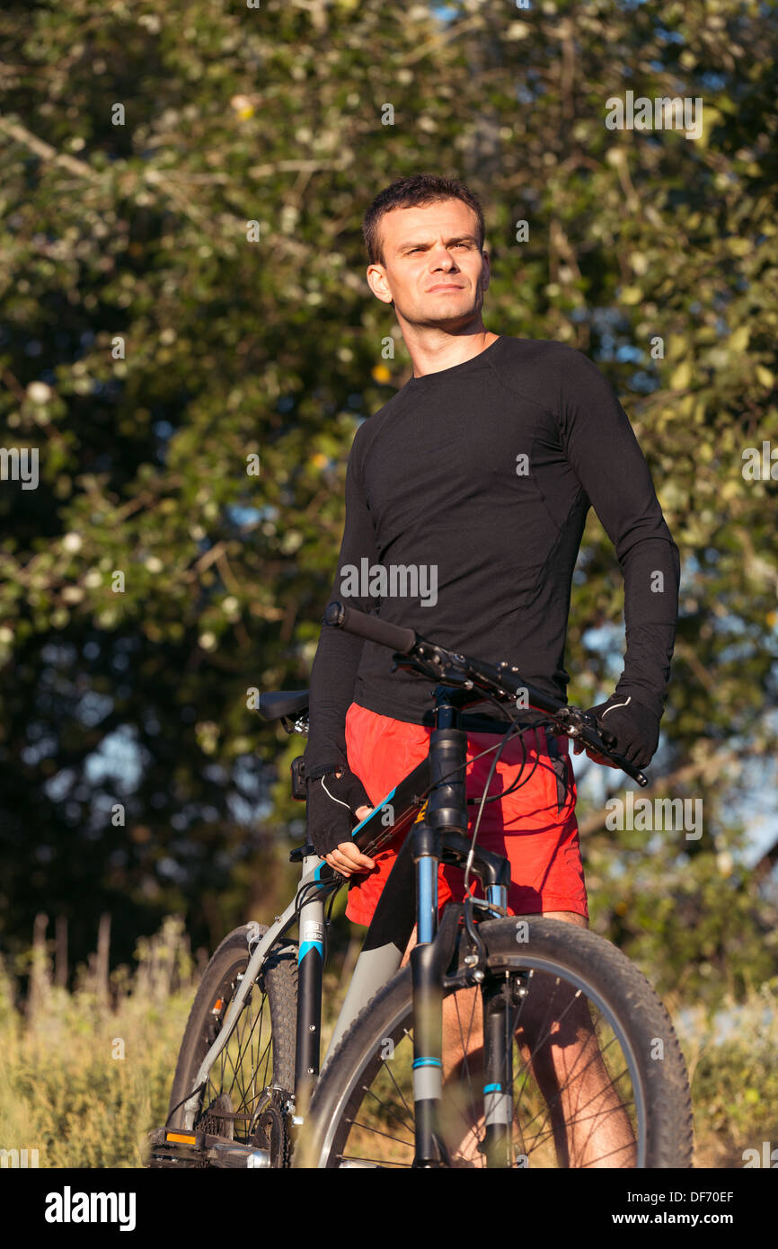 Mountain bike cyclist riding at sunrise healthy lifestyle active ...