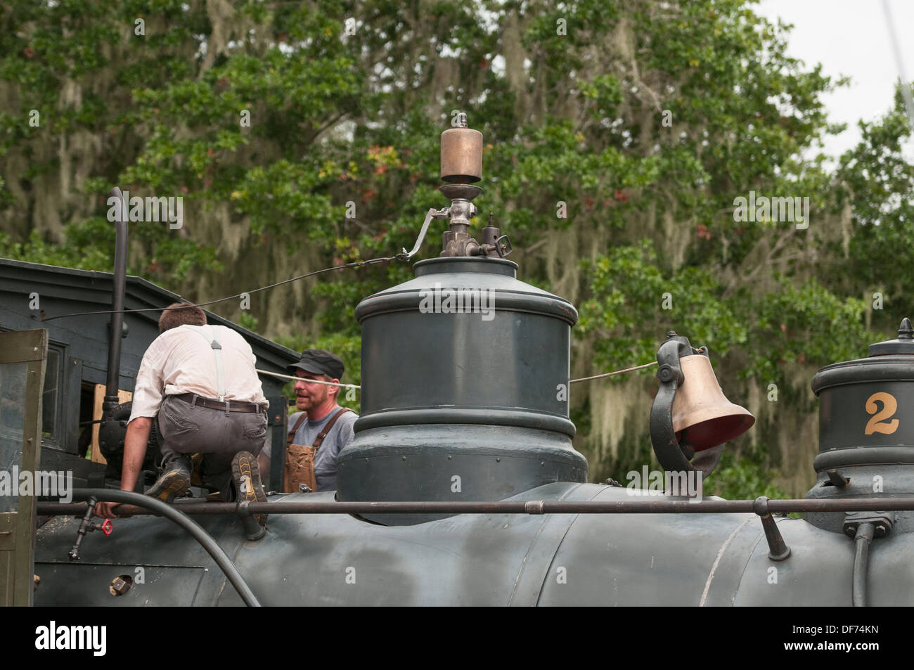 Men working on a Locomotive Wood burning Steam Train located in Tavares ...