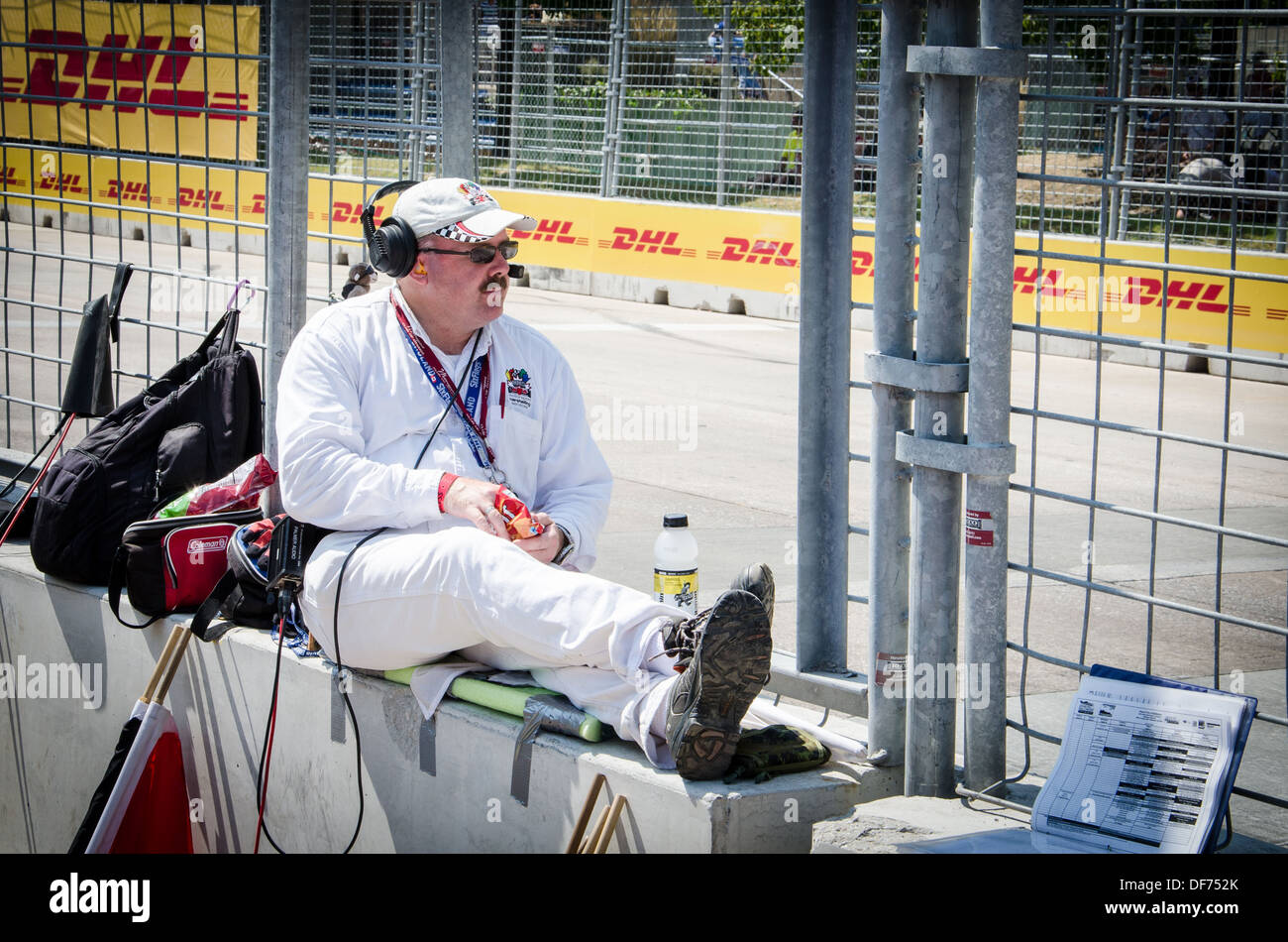 Race Marshal relaxing at the Baltimore Grand Prix Stock Photo - Alamy
