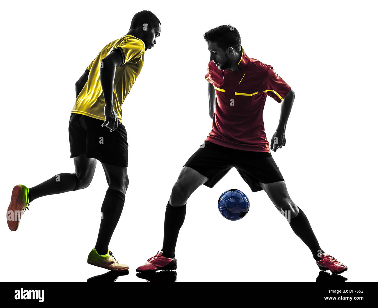 two men soccer player playing football competition in silhouette on ...