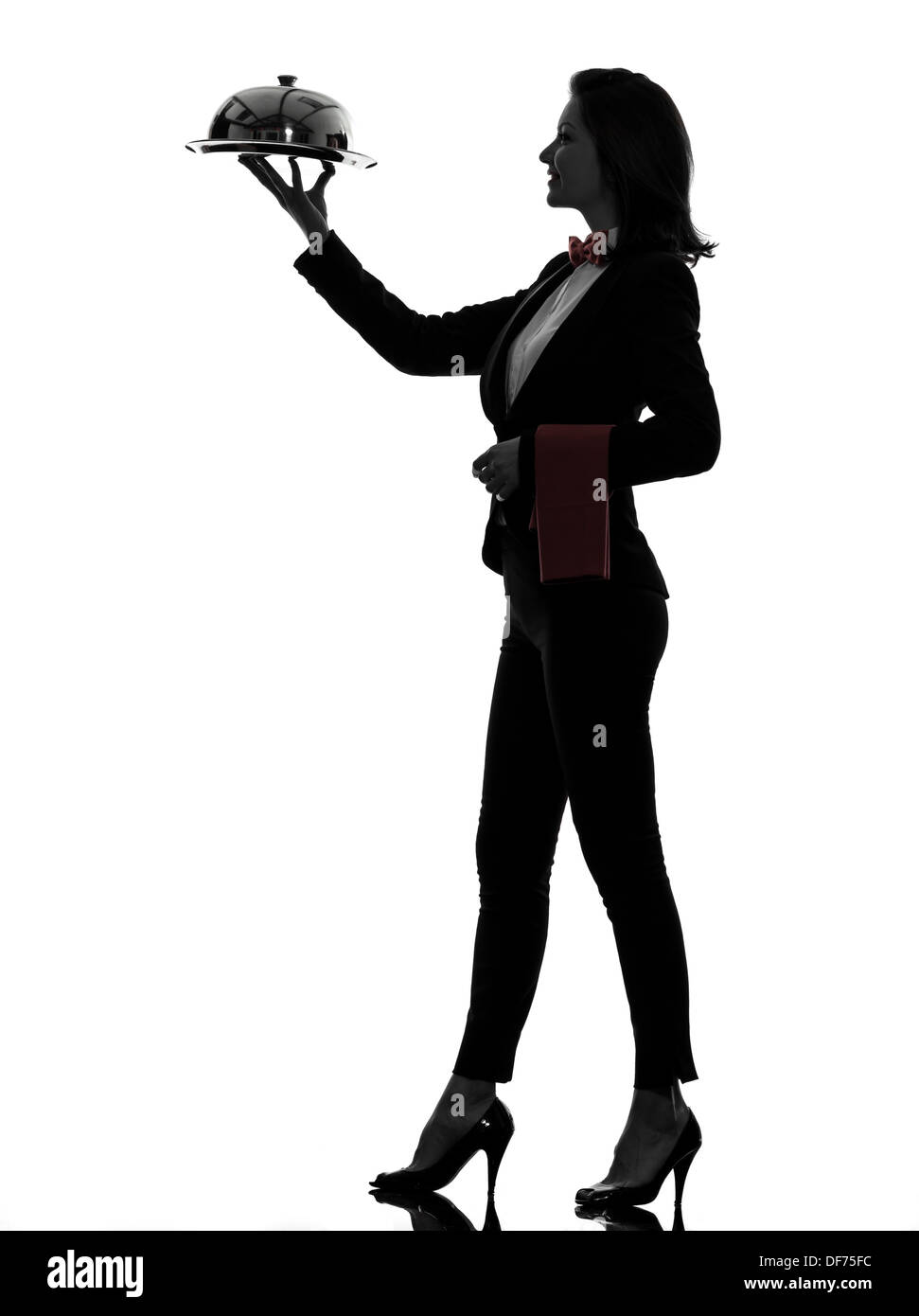 one woman waiter butler serving dinner with catering dome in silhouette ...