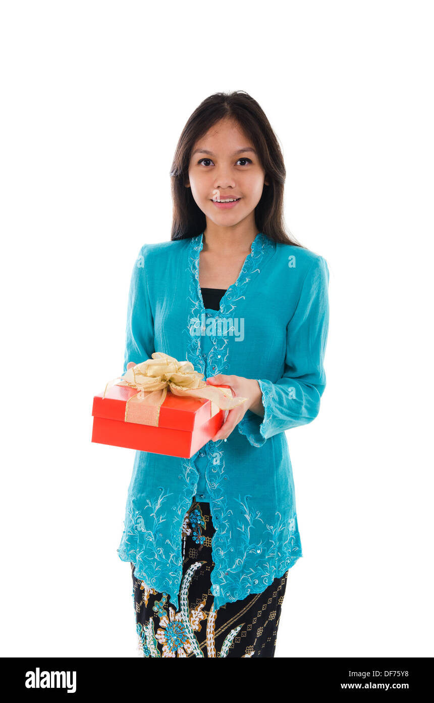 traditional young malay girl holding a gift Stock Photo - Alamy