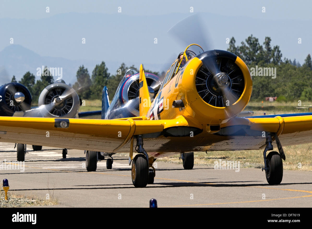 World War II era T-6 Texan trainers taxi down the ramp at the Nevada ...