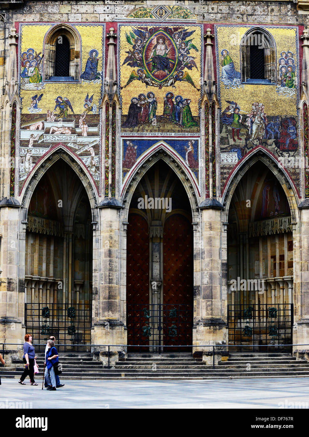 Tourist walking by the Astronomical clock building in Prague's Old town ...