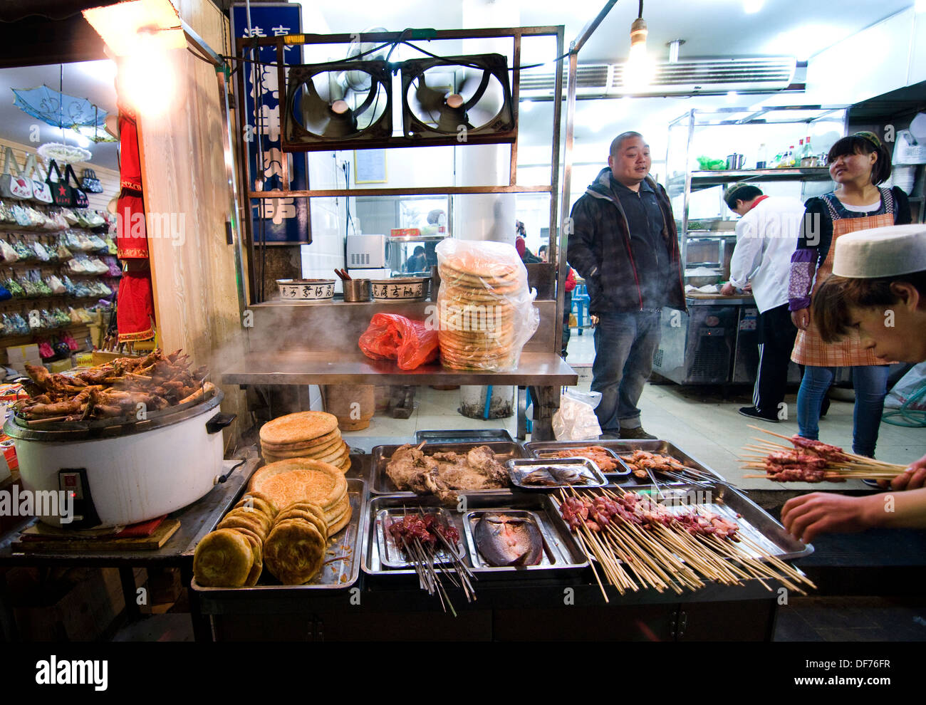 A street food stall in the vibrant street food market in Xian's Muslim ...