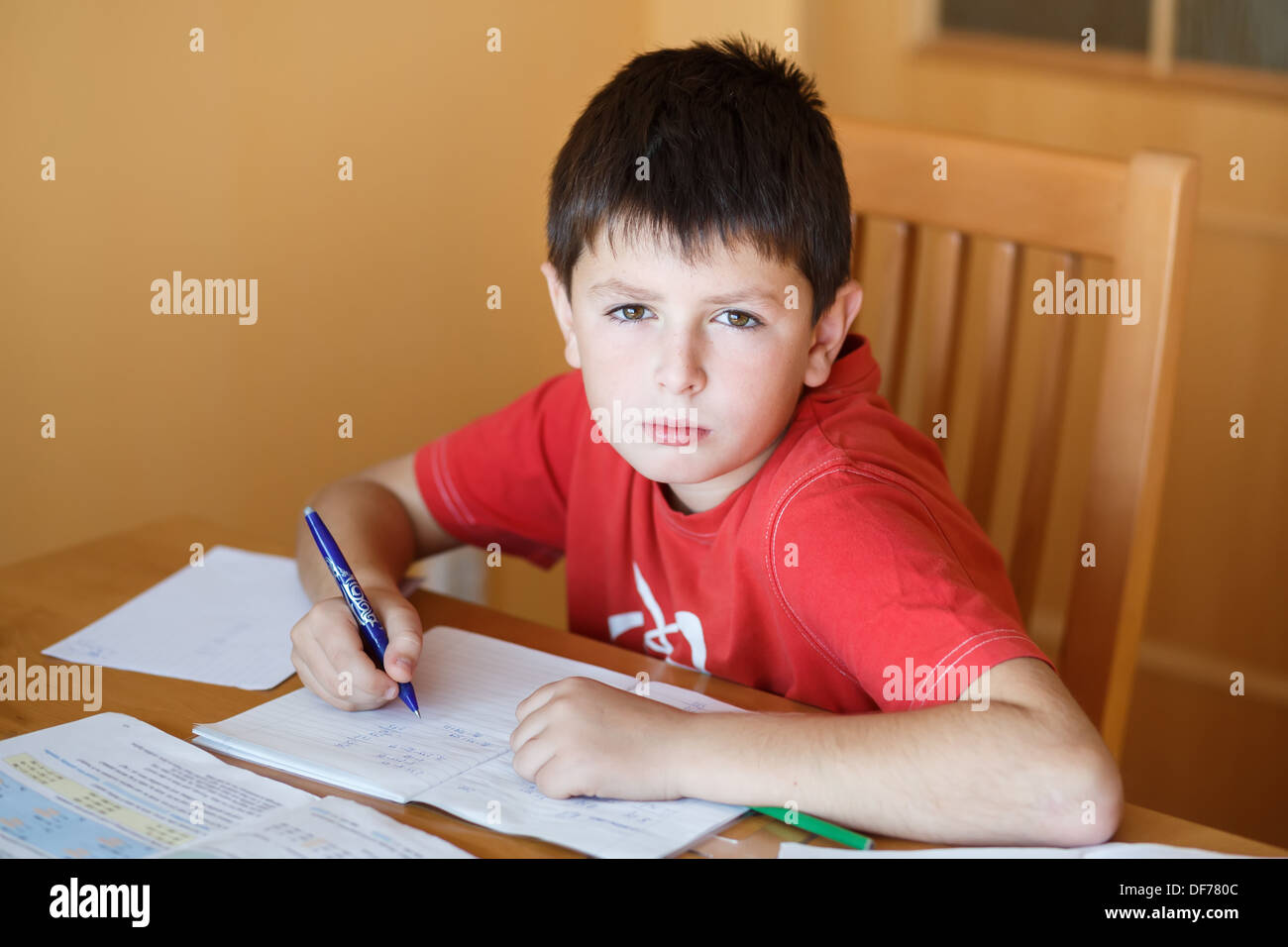 Boy doing school homework from mathematics hi-res stock photography and ...