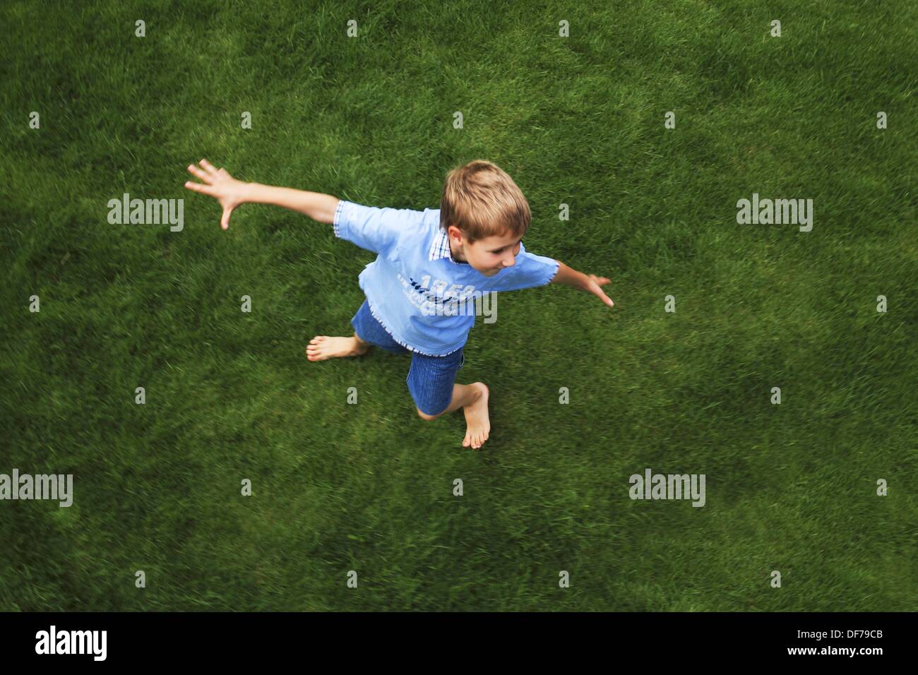 Boy spinning around hi-res stock photography and images - Alamy