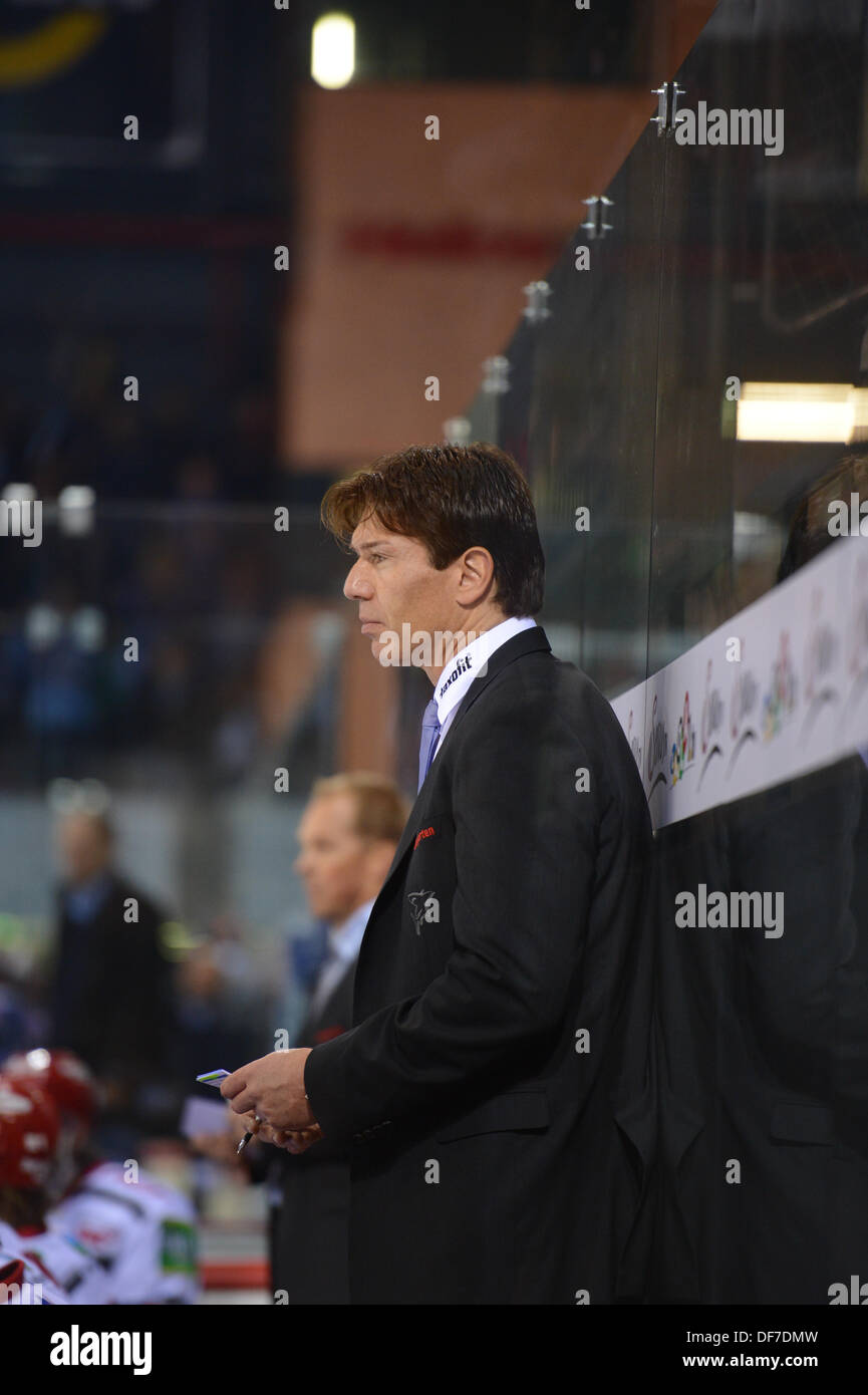 Cologne's head coach Uwe Krupp follows the DEL ice hockey match between ...