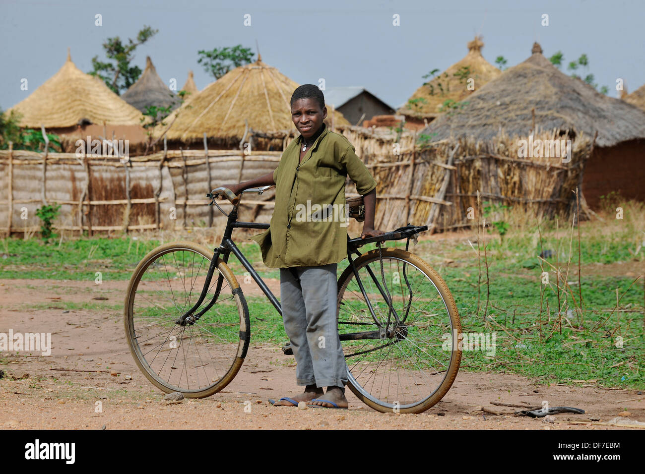 Cyclist in a village, Garoua, North Region, Cameroon Stock Photo - Alamy