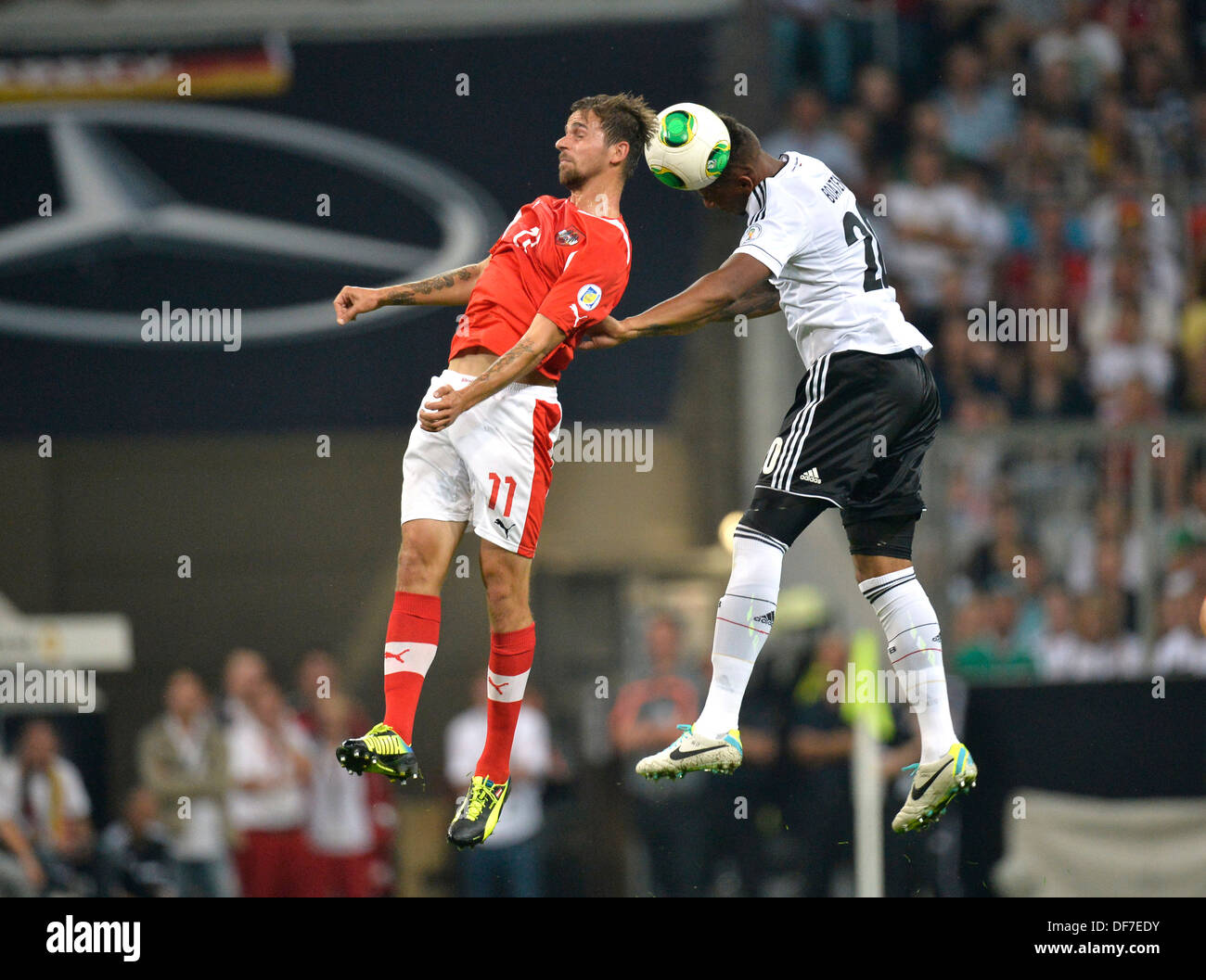 Aerial duel between the DFB national player Jerome Boateng, right Stock ...