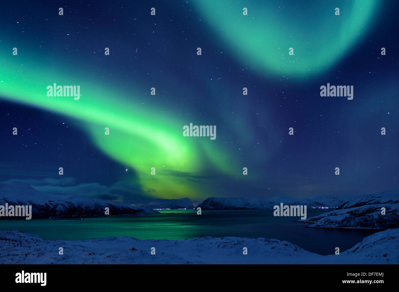 Northern Lights over fjord in winter landscape, Sommeroya, Tromsø ...