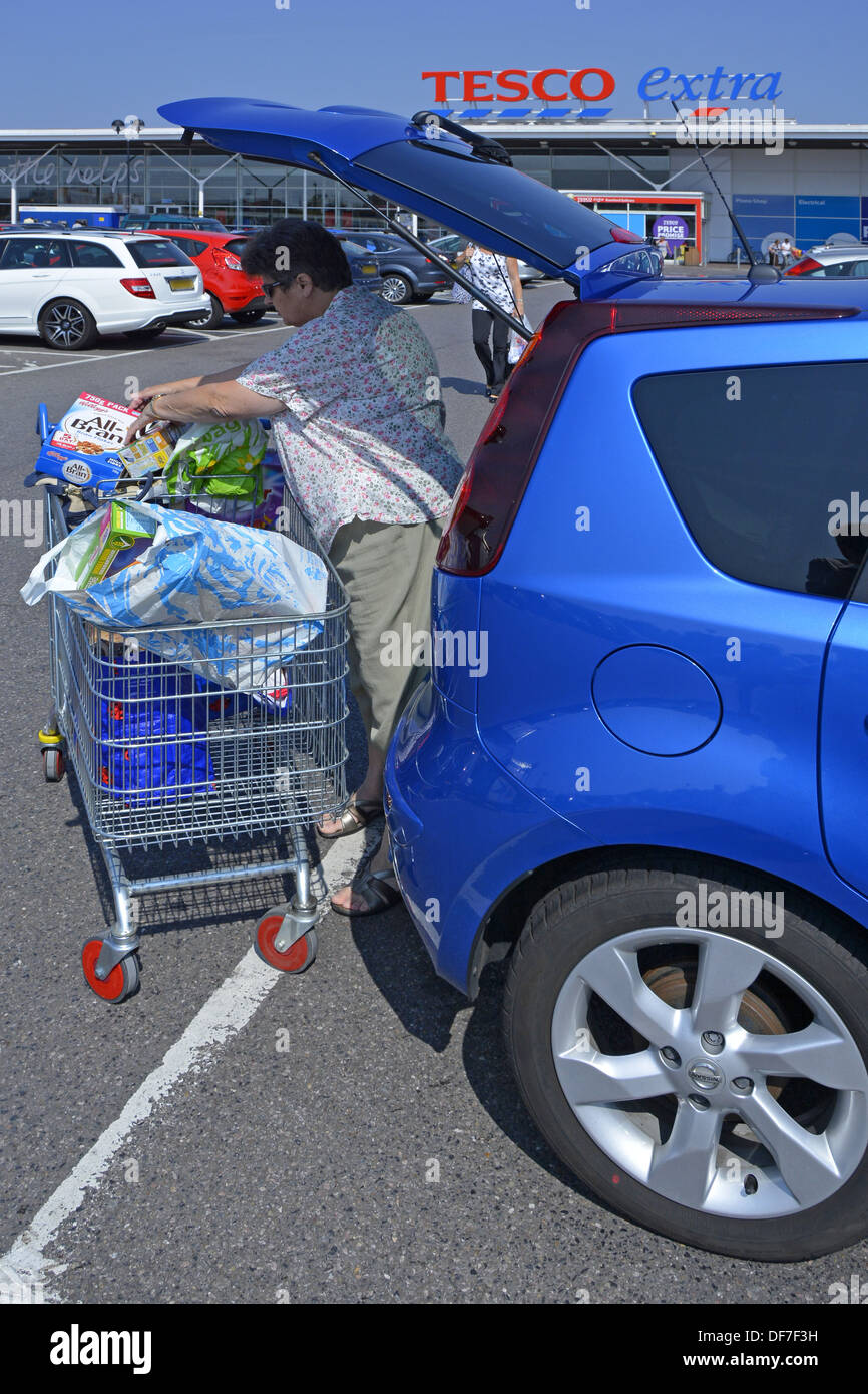 Woman Unloading Trolley High Resolution Stock Photography and Images ...