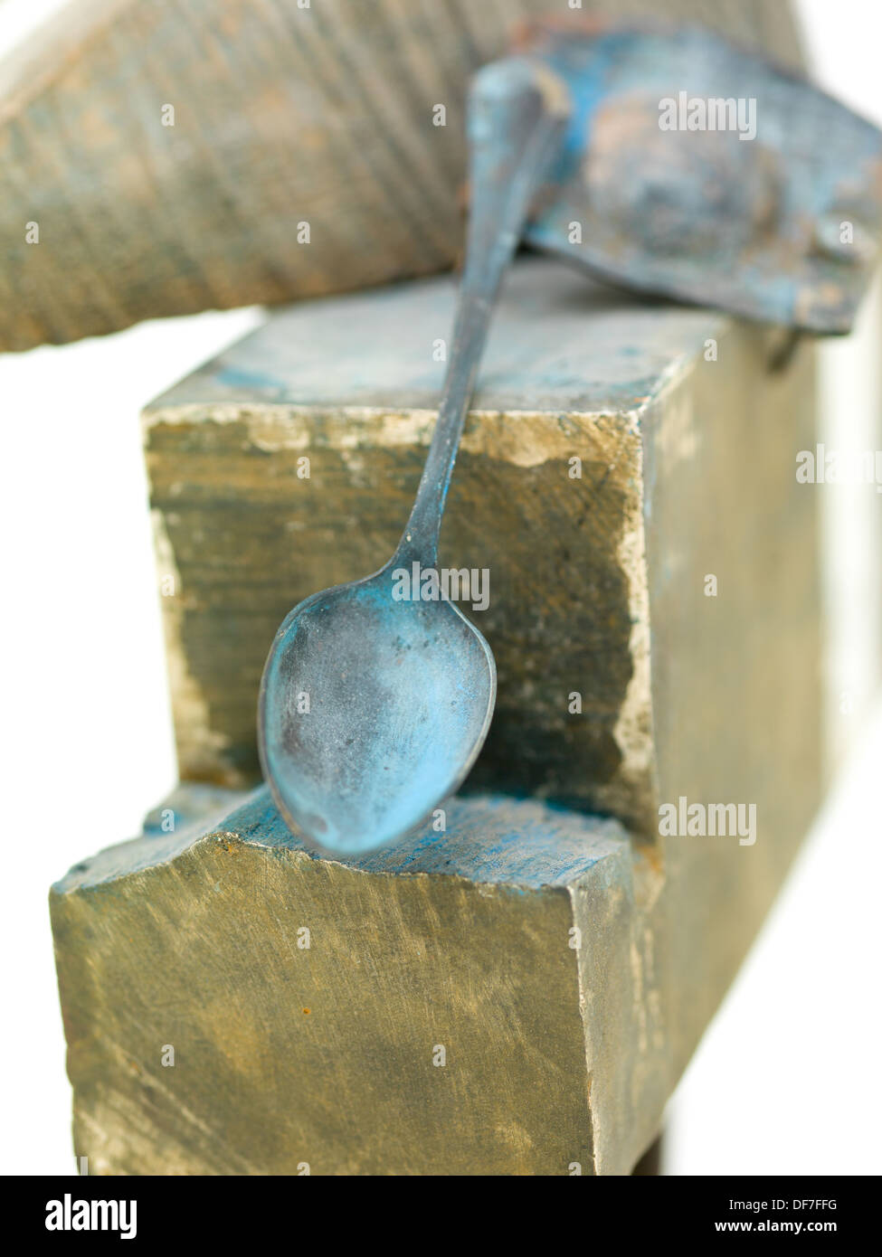 macro of a rusty spoon with blue paint placed on a piece of wood Stock ...