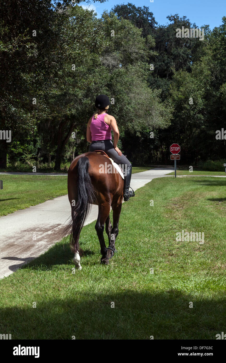 Girl riding horse on trail hi-res stock photography and images - Alamy