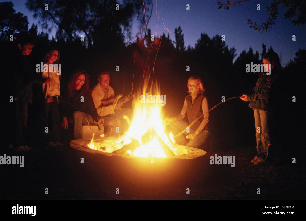 Family by the campfire talking hi-res stock photography and images - Alamy