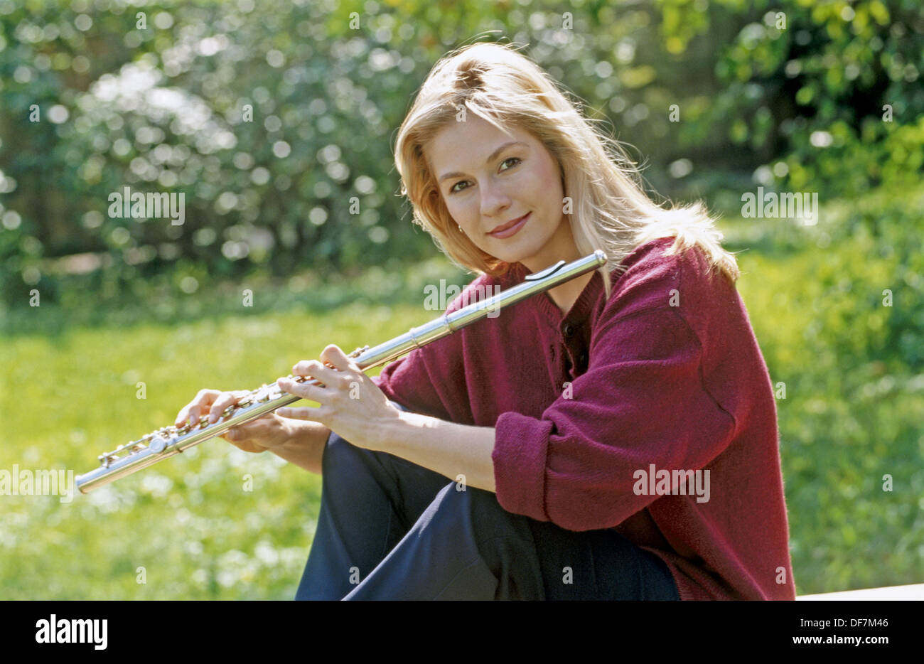 Person playing flute hi-res stock photography and images - Alamy
