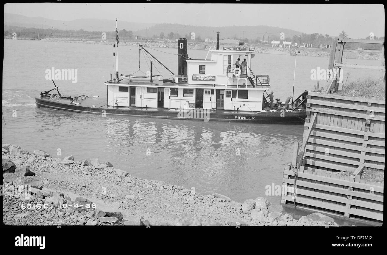 A pioneer boat used for towing barges, showcasing the transport methods ...