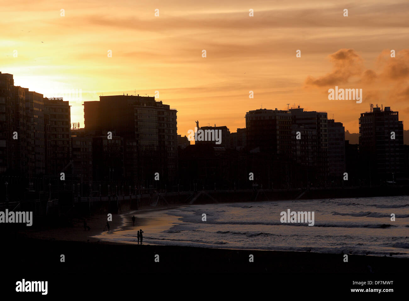 Sunset on the beach of San Lorenzo in Gijon, Asturias, Spain Stock ...