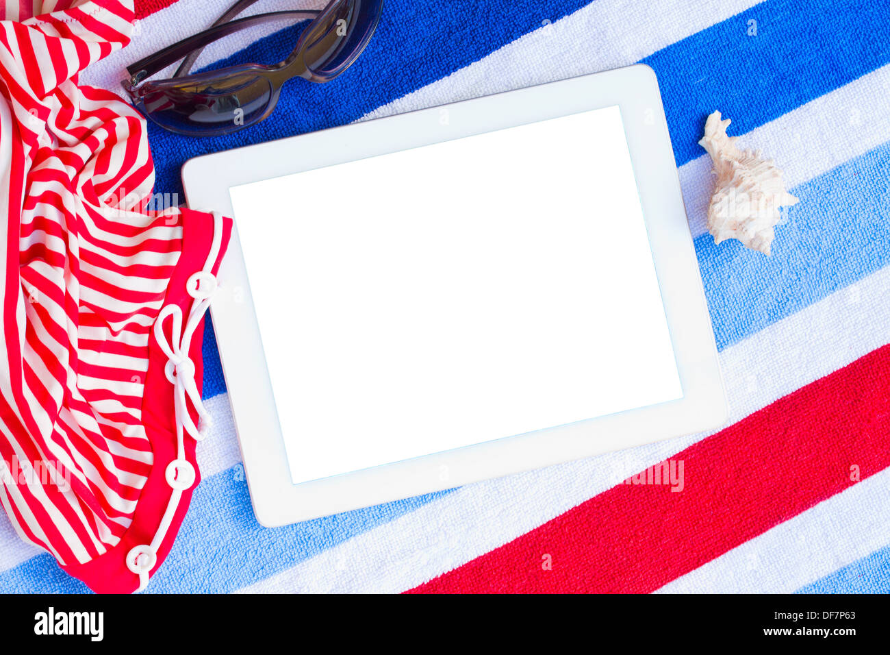 tablet on beach towels with sunbathing accessories Stock Photo - Alamy