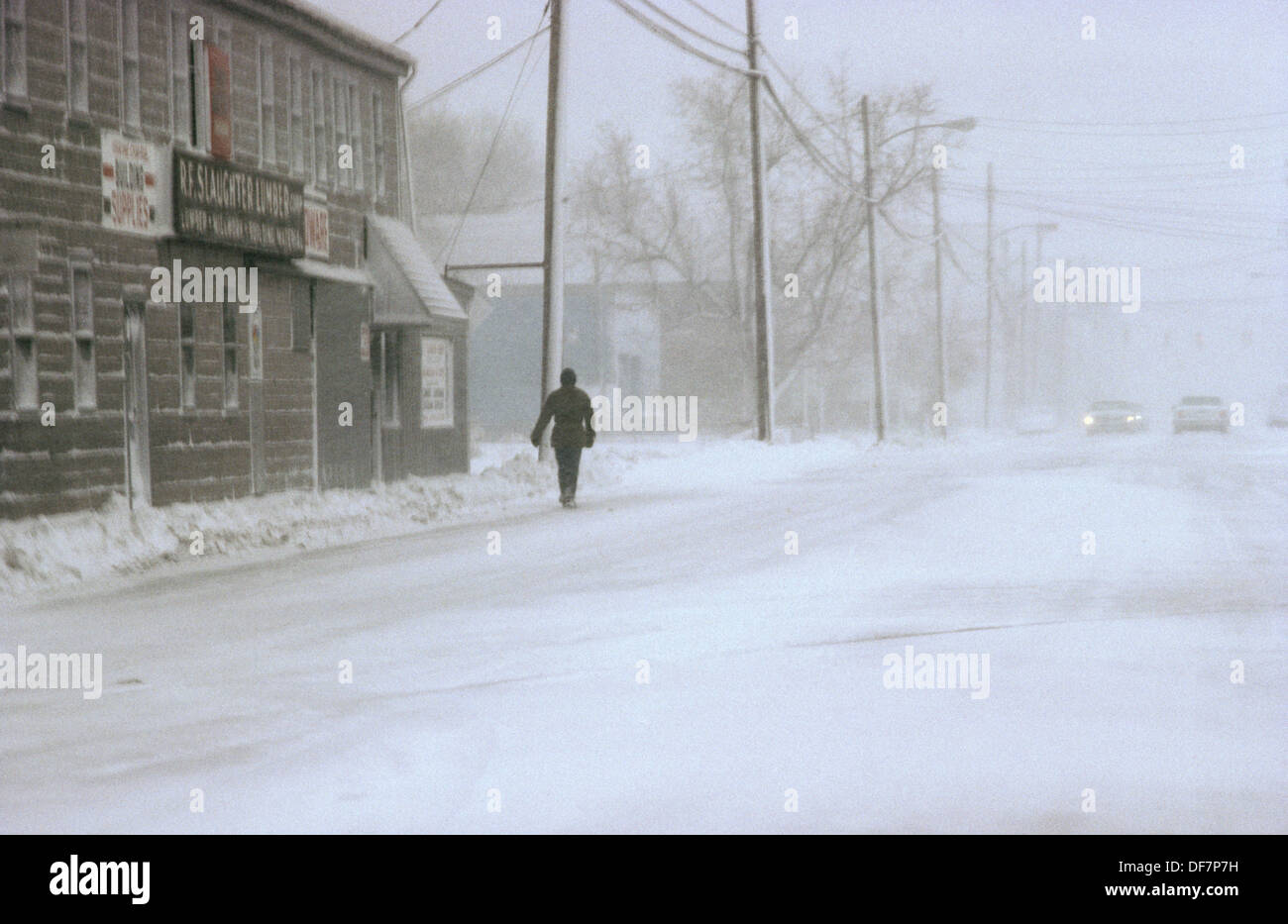 Man walking street snow storm hi-res stock photography and images - Alamy
