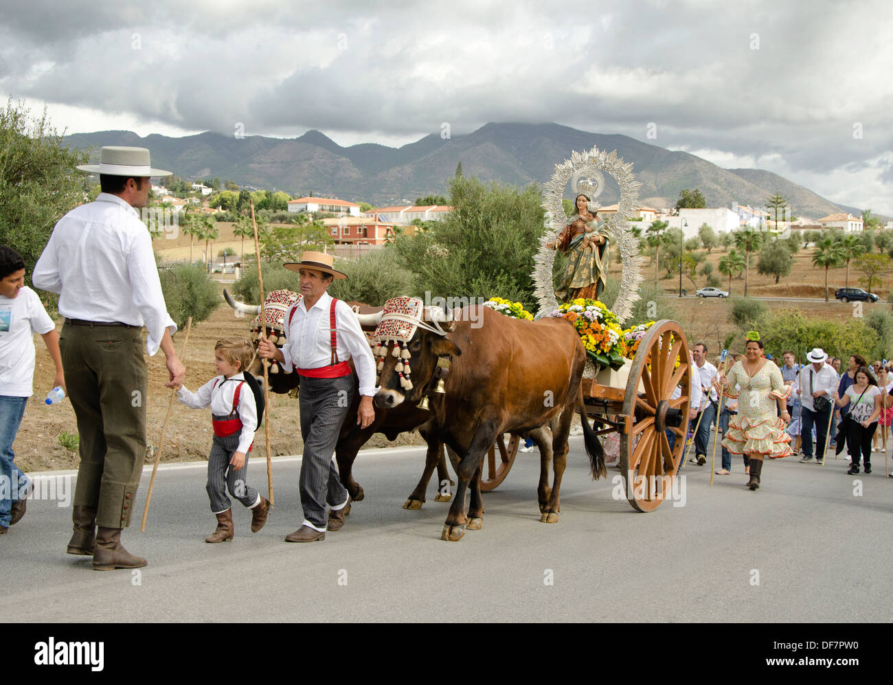 Procession with traditionally dressed andalusians during romeria or ...