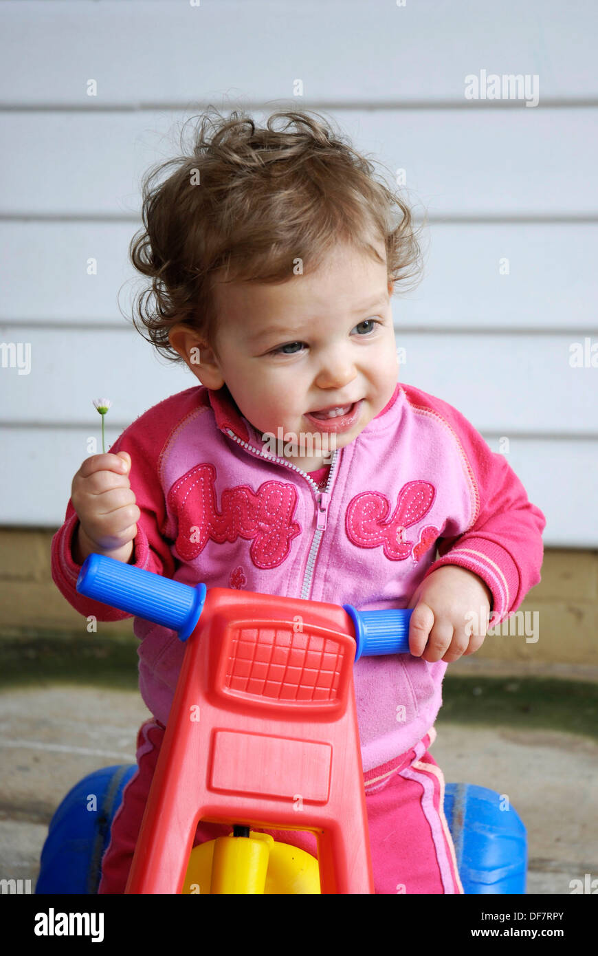 Girl riding a tricycle hi-res stock photography and images - Alamy