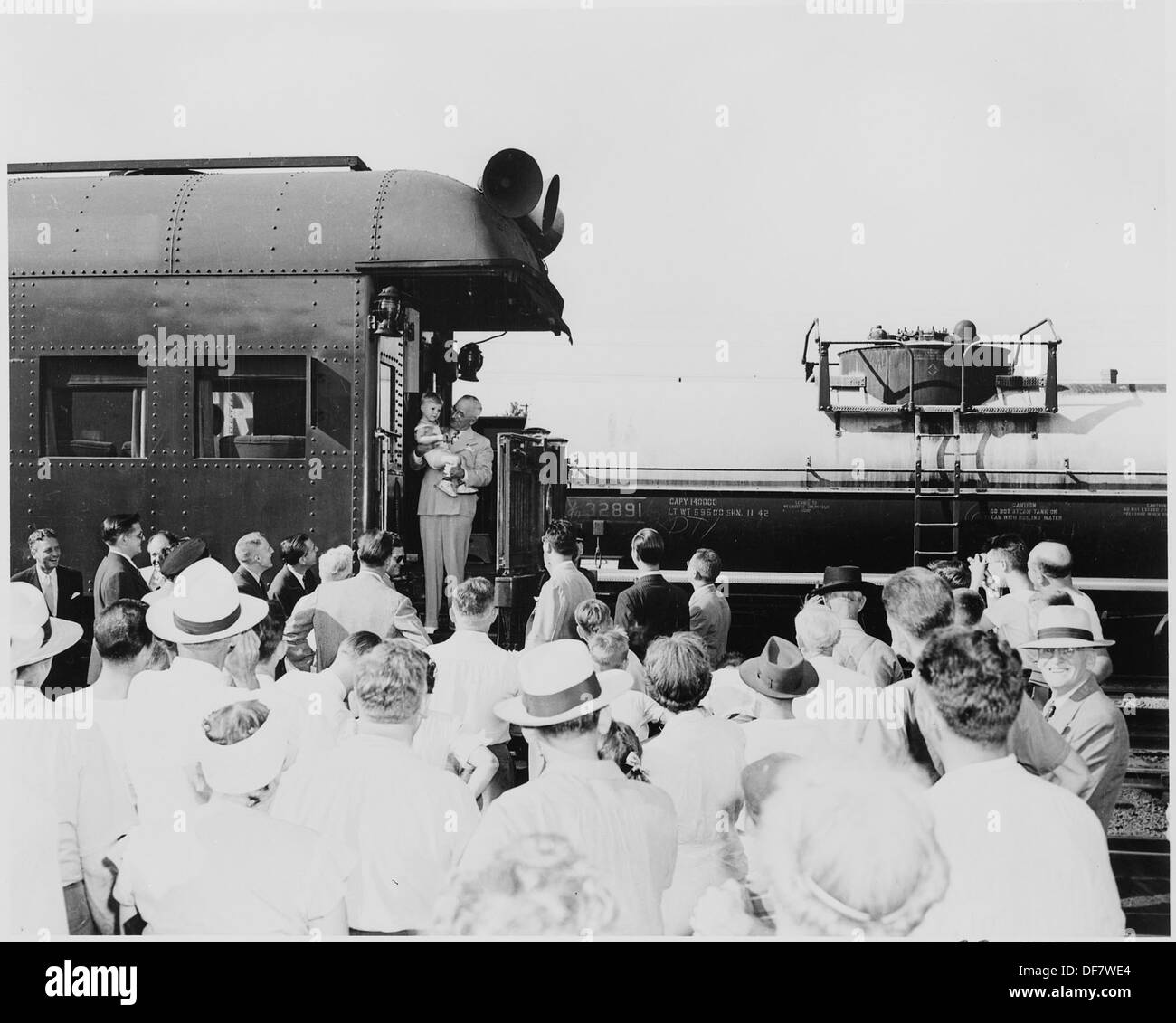 President Harry S. Truman is pictured standing on the rear platform of ...