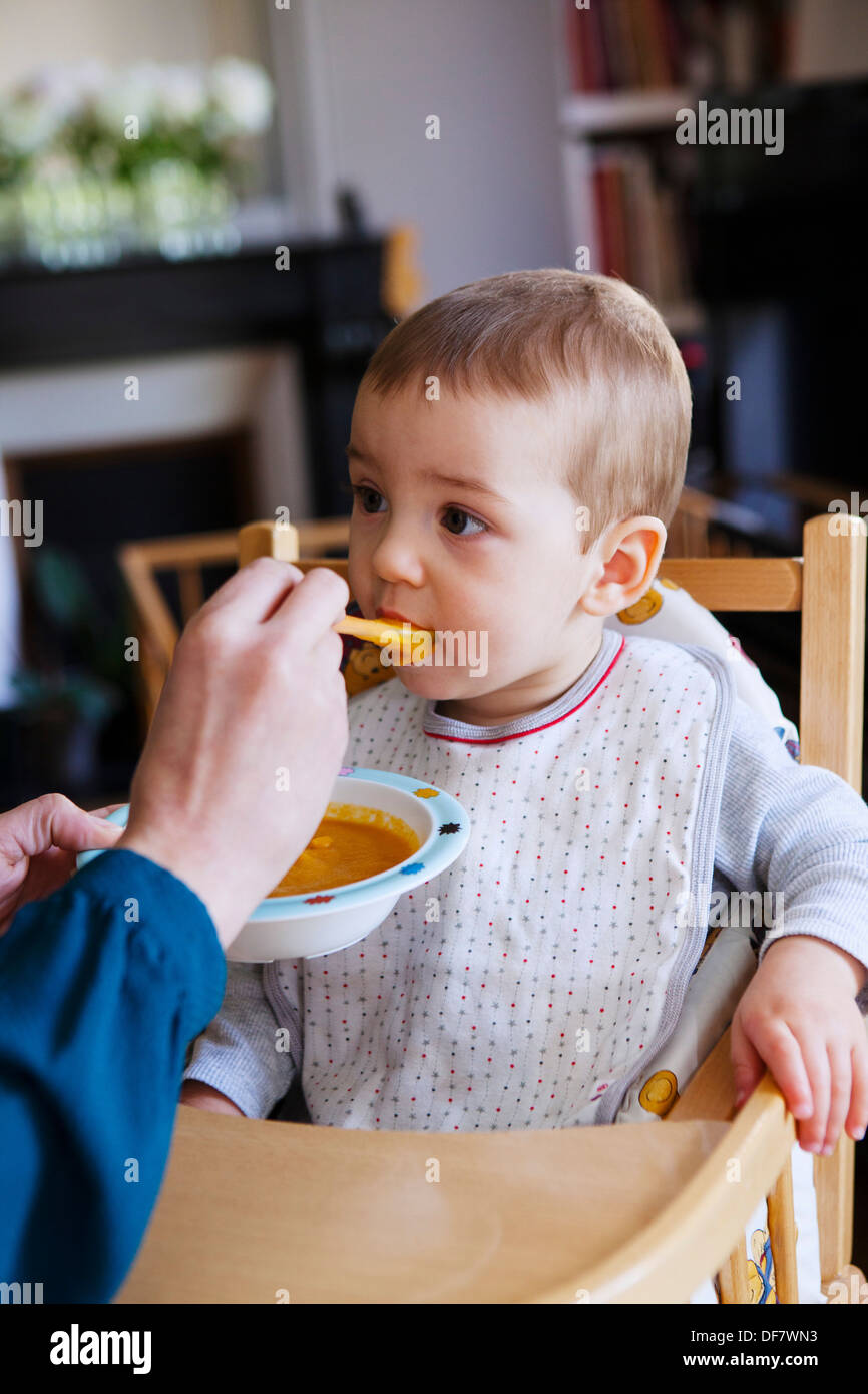 CHILD EATING A MEAL Stock Photo - Alamy