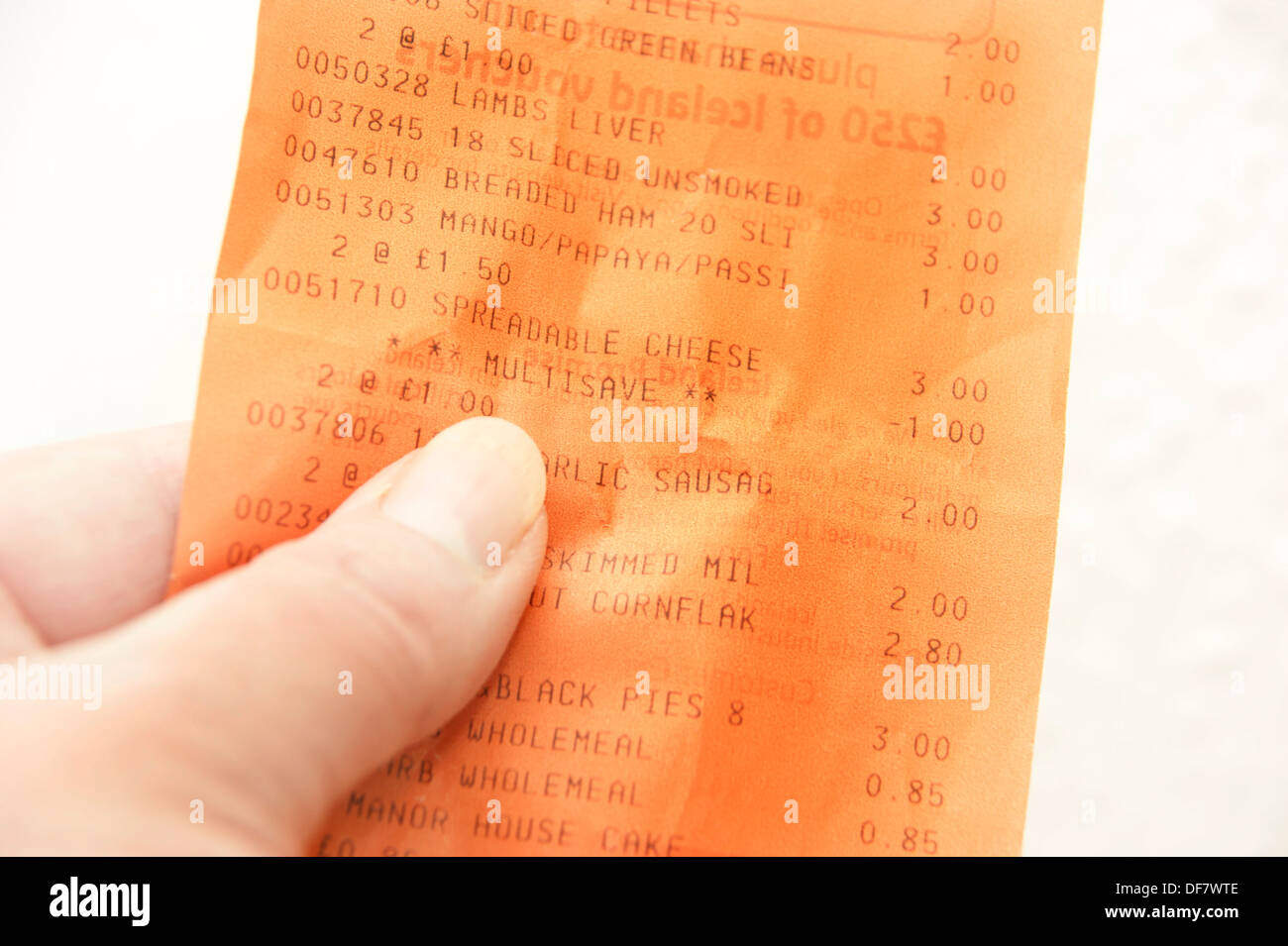 Woman checking prices of shopping looking at till receipt bill from ...