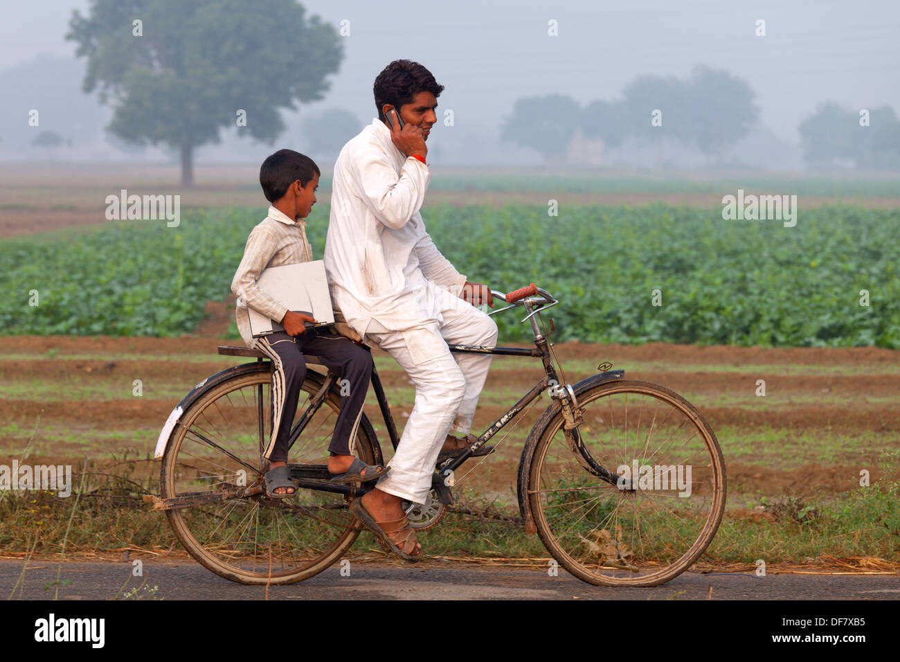 Indian boy riding bicycle on hi-res stock photography and images - Alamy