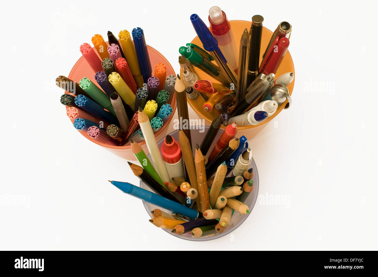 Colorful pens, felt-tips, markers and pencils in a box container on a ...