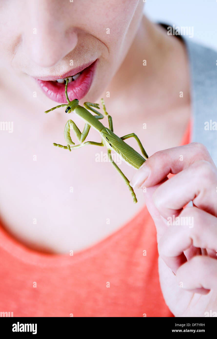 WOMAN EATING INSECT Stock Photo - Alamy