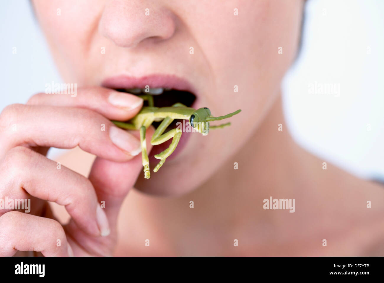WOMAN EATING INSECT Stock Photo - Alamy