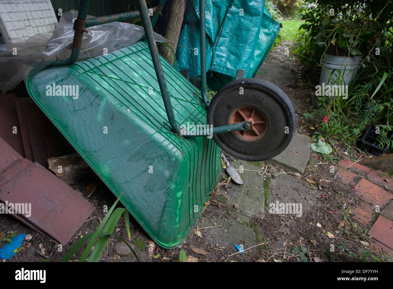 Upside down wheelbarrow in a back garden Stock Photo - Alamy