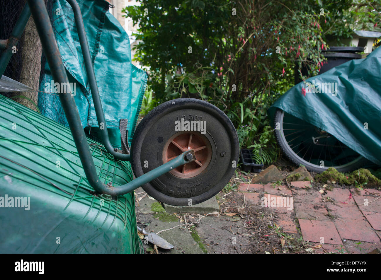 Upside down wheelbarrow in a back garden Stock Photo - Alamy
