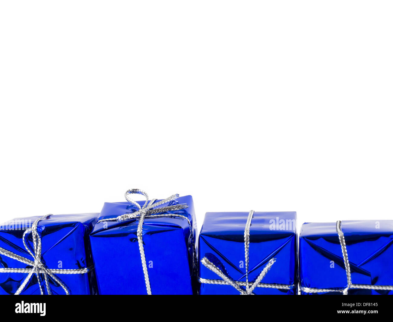 Blue Christmas gifts isolated over white background Stock Photo - Alamy