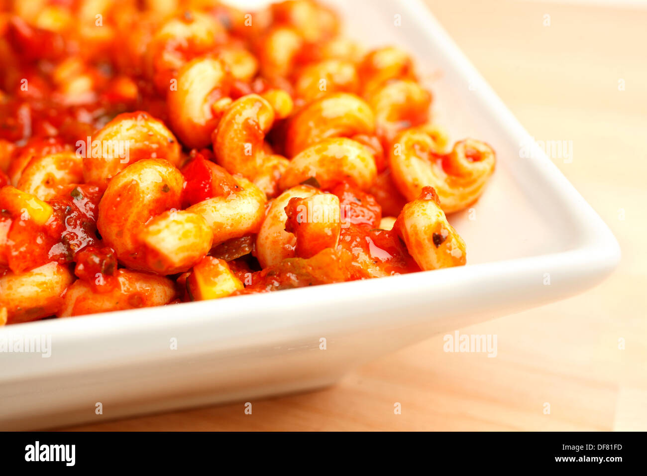 Pasta with tomato sauce served in square serving dish Stock Photo - Alamy