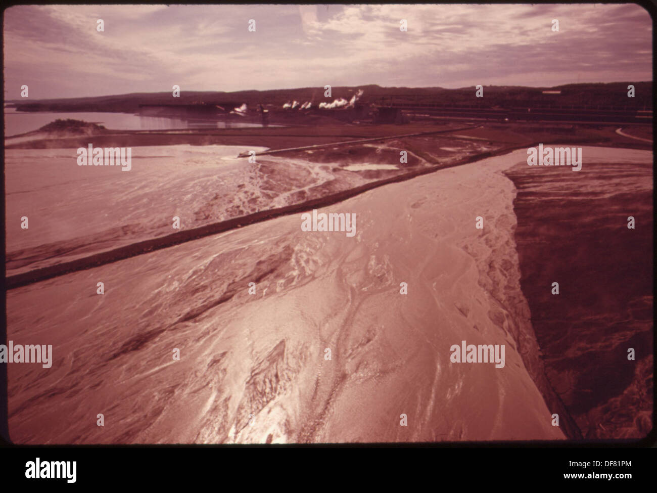 Reserve Mining Company's dump site on Lake Superior is shown, with foul ...