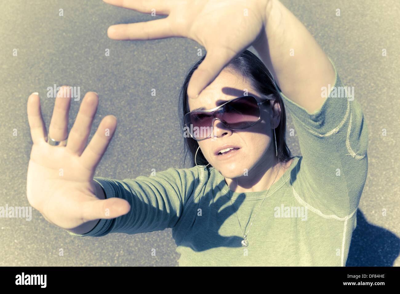 Hand blocking sun hi-res stock photography and images - Alamy