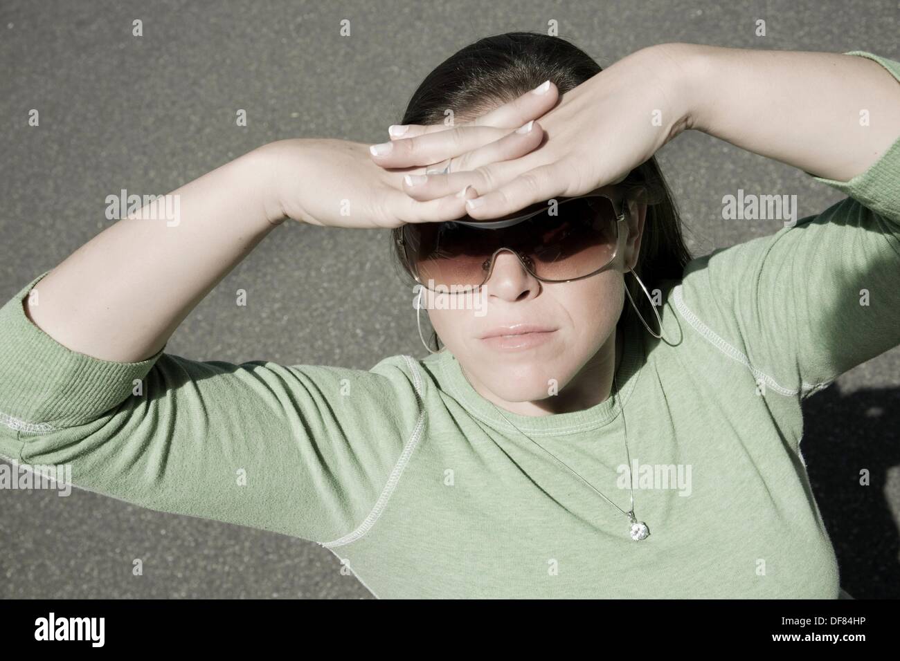 Hand blocking sun hi-res stock photography and images - Alamy