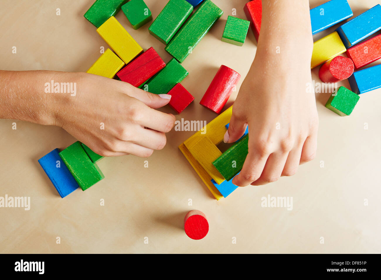 Hand building blocks hi-res stock photography and images - Alamy